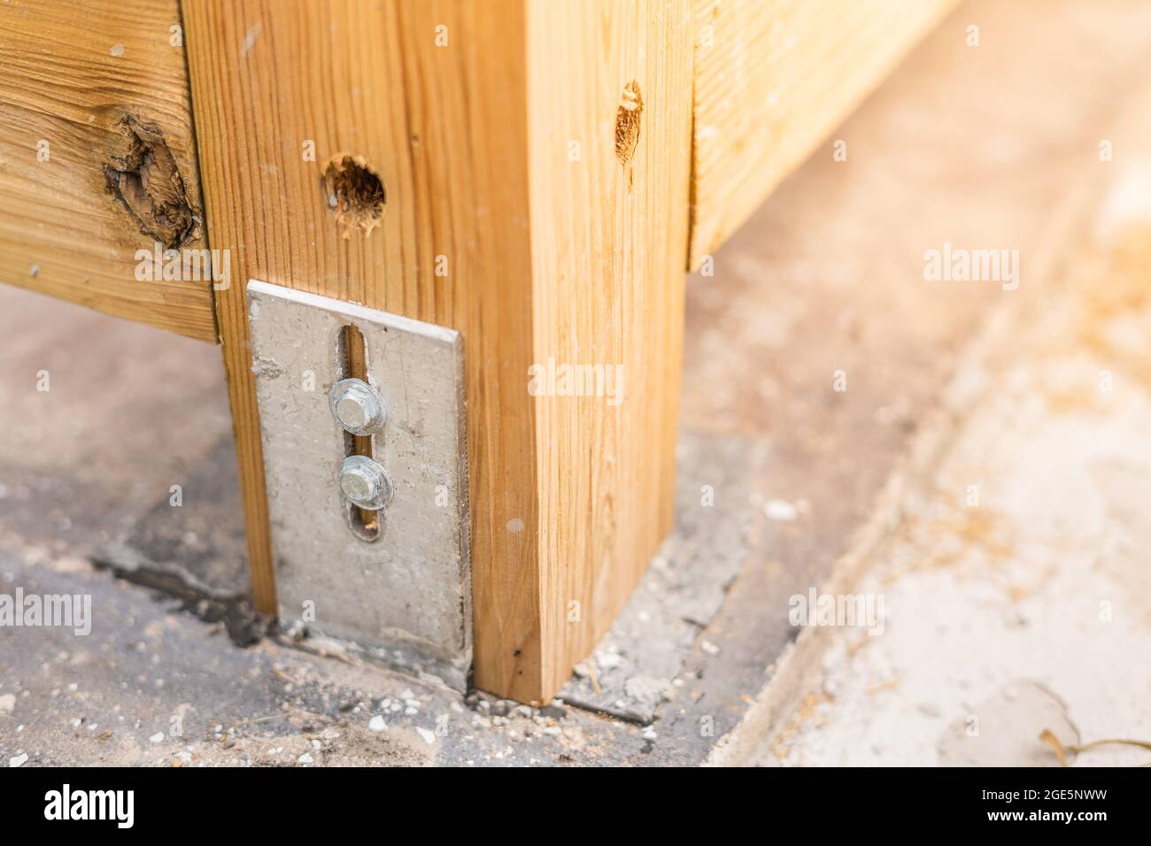 Fastening a timber frame to a concrete foundation Stock Photo - Alamy