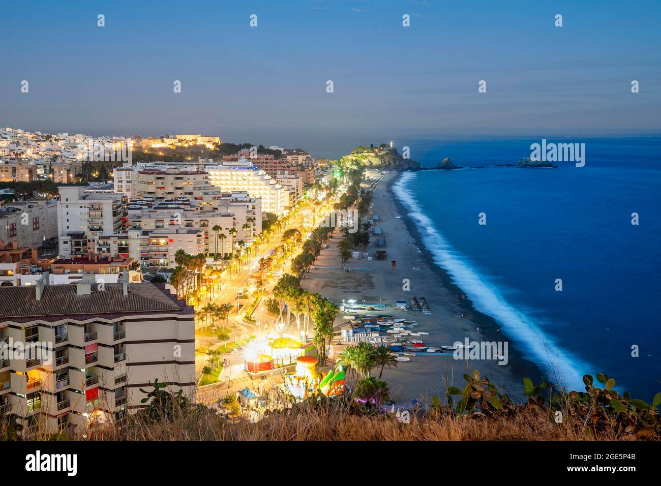 Panorama of touristic illuminated coast in Almunecar at night ...