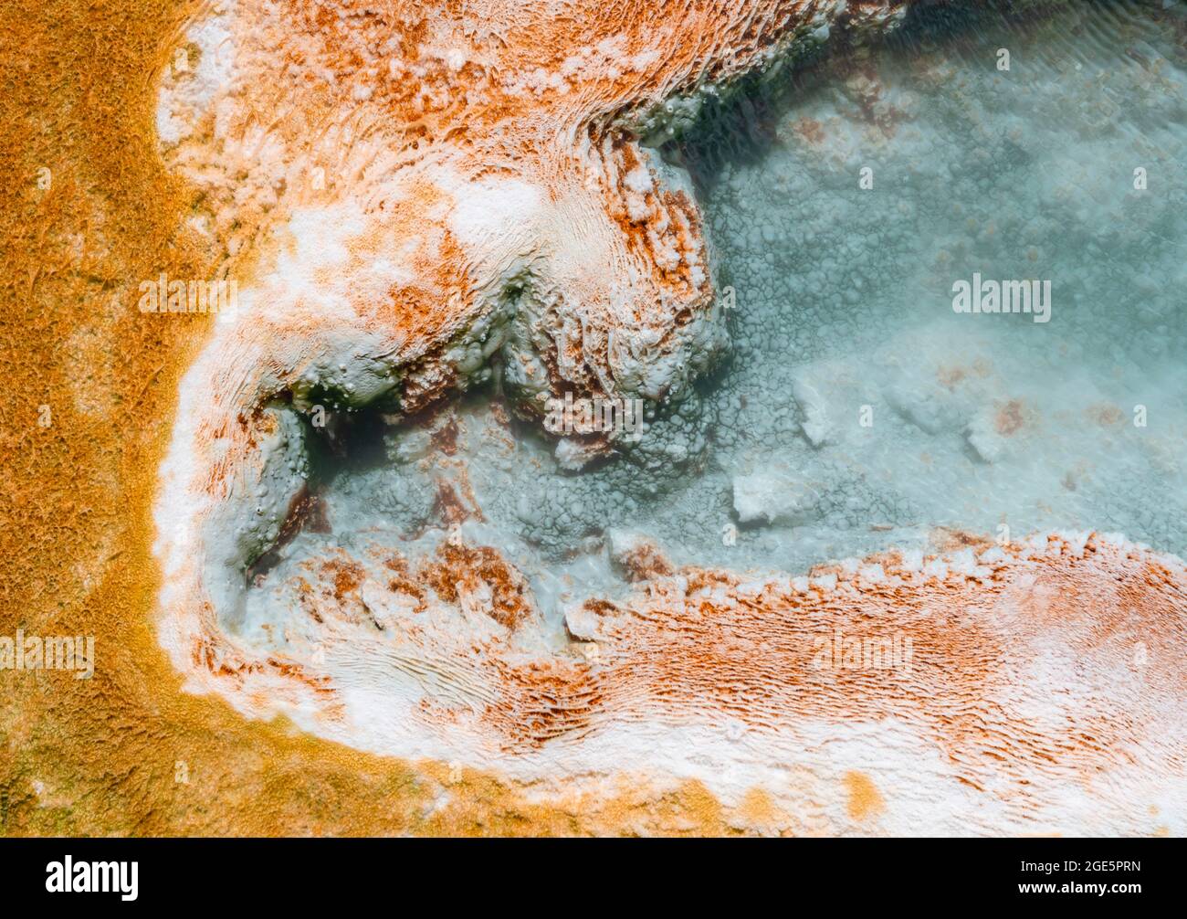 Detail photo, hot spring with orange mineral deposits and bacterial ...