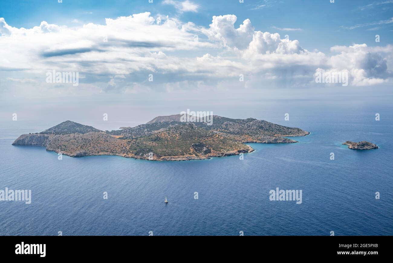 Sailboat on the sea, view of the island of Seskli, Symi, Dodecanese ...