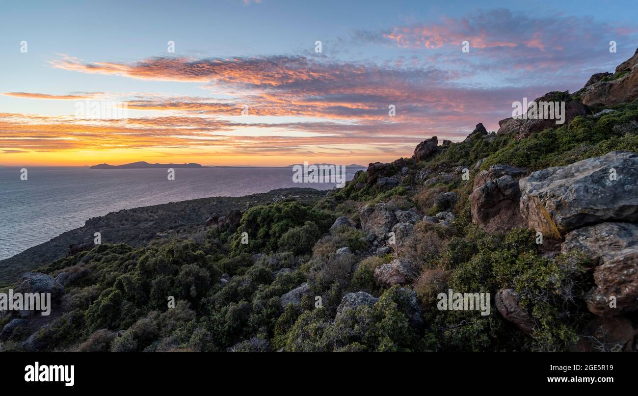 Sunset over the sea, landscape with macchia, in the back islands Gyali ...