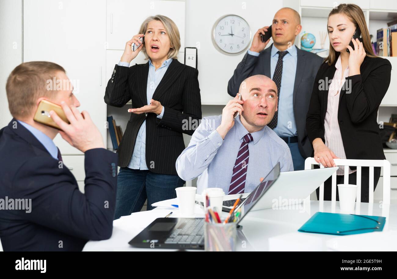 Crisis in the modern office: managers are urgent negotiations by phones ...