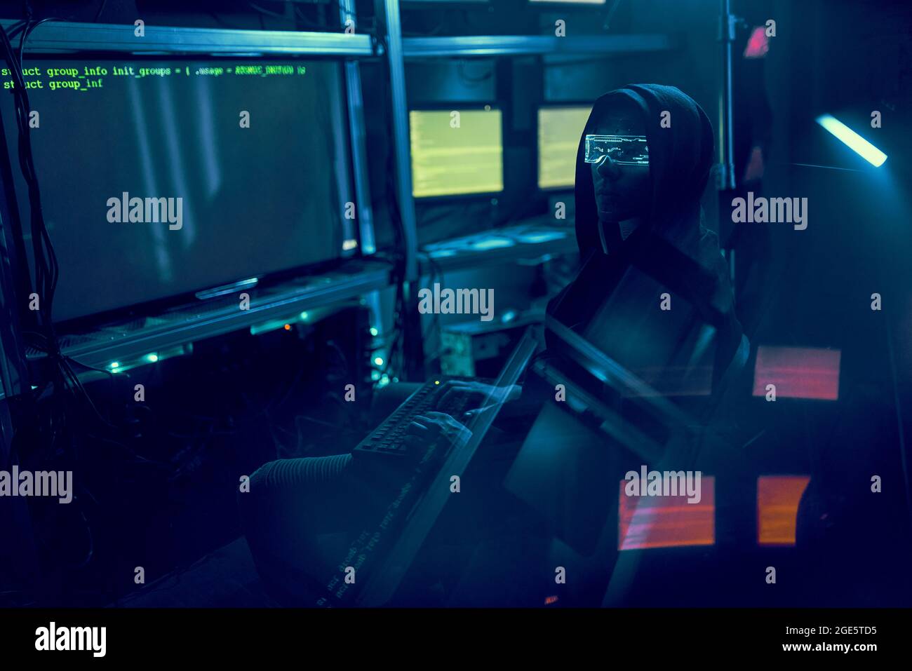 Cyber hacker breaks into databases to obtain information using a computer. Cybercrime and data ...