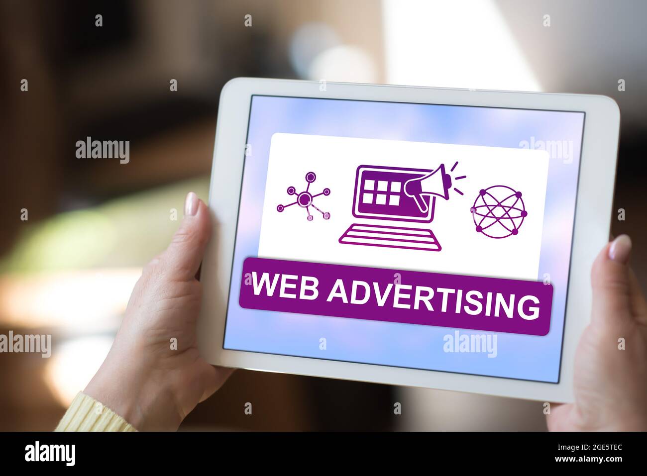 Tablet screen displaying a web advertising concept Stock Photo - Alamy