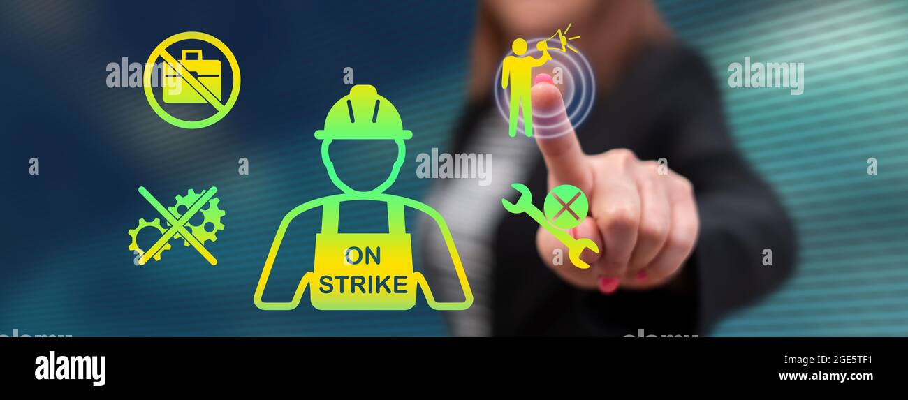 Woman touching a strike concept on a touch screen with her finger Stock ...