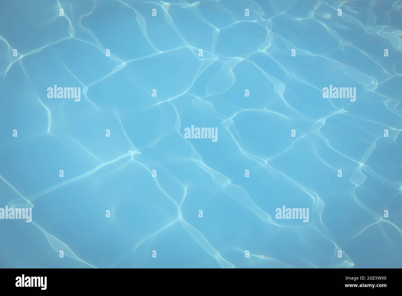 Vintage Blue pool water with sun reflections background Stock Photo - Alamy