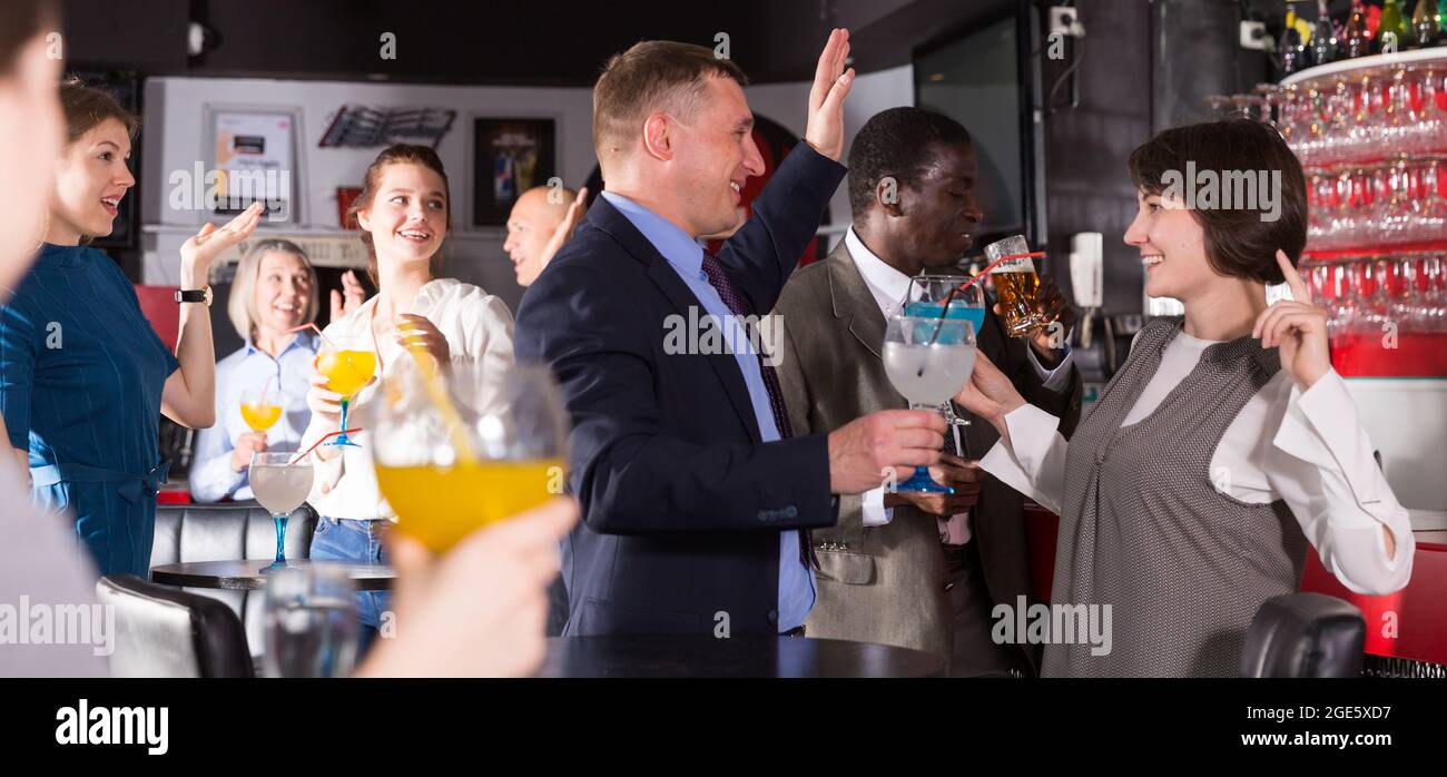 Two colleagues having conversation Stock Photo - Alamy
