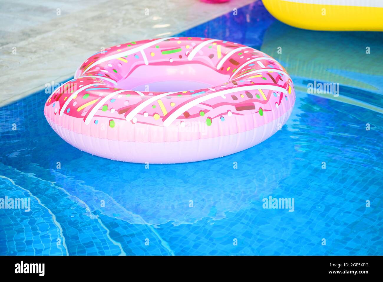 summer vacation. Relax by the pool. Inflatable ring, pink donut Stock ...