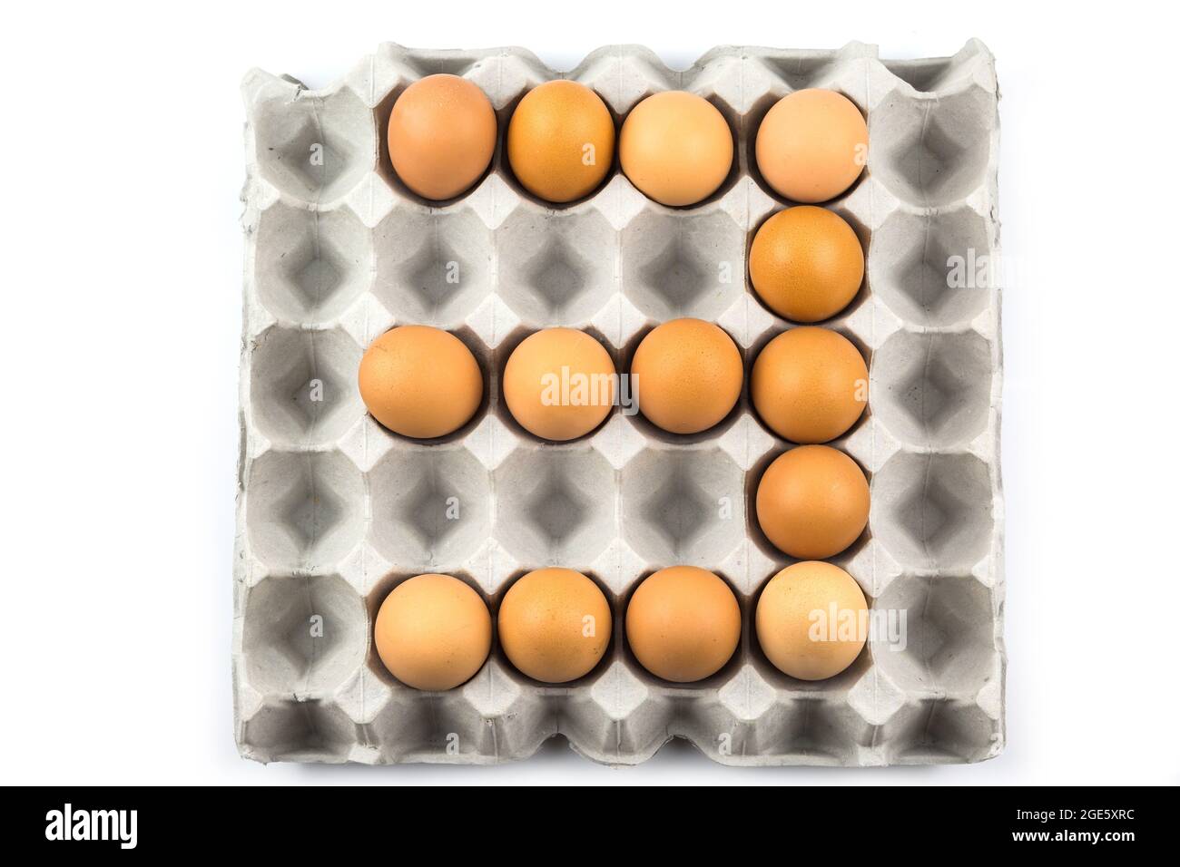 Eggs arranged in a number isolated on white background Stock Photo - Alamy