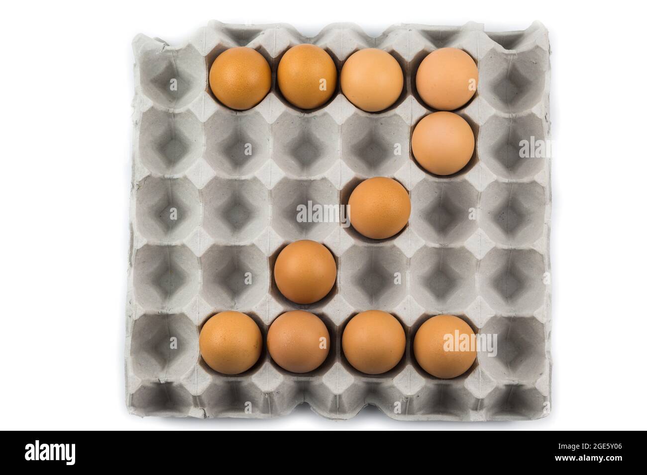 Eggs arranged in a number isolated on white background Stock Photo - Alamy