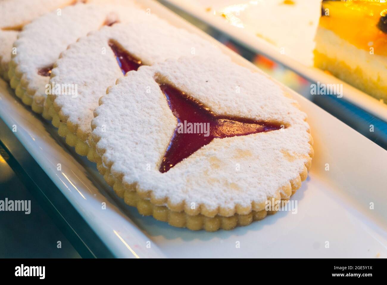 A three, tri star symbol, logo on a cookie at the cafe. At the Mercedes ...