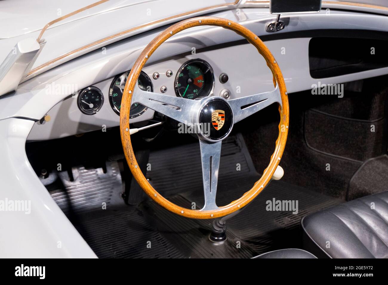 Cockpit, dashboard and wood steering wheel details of a convertible ...