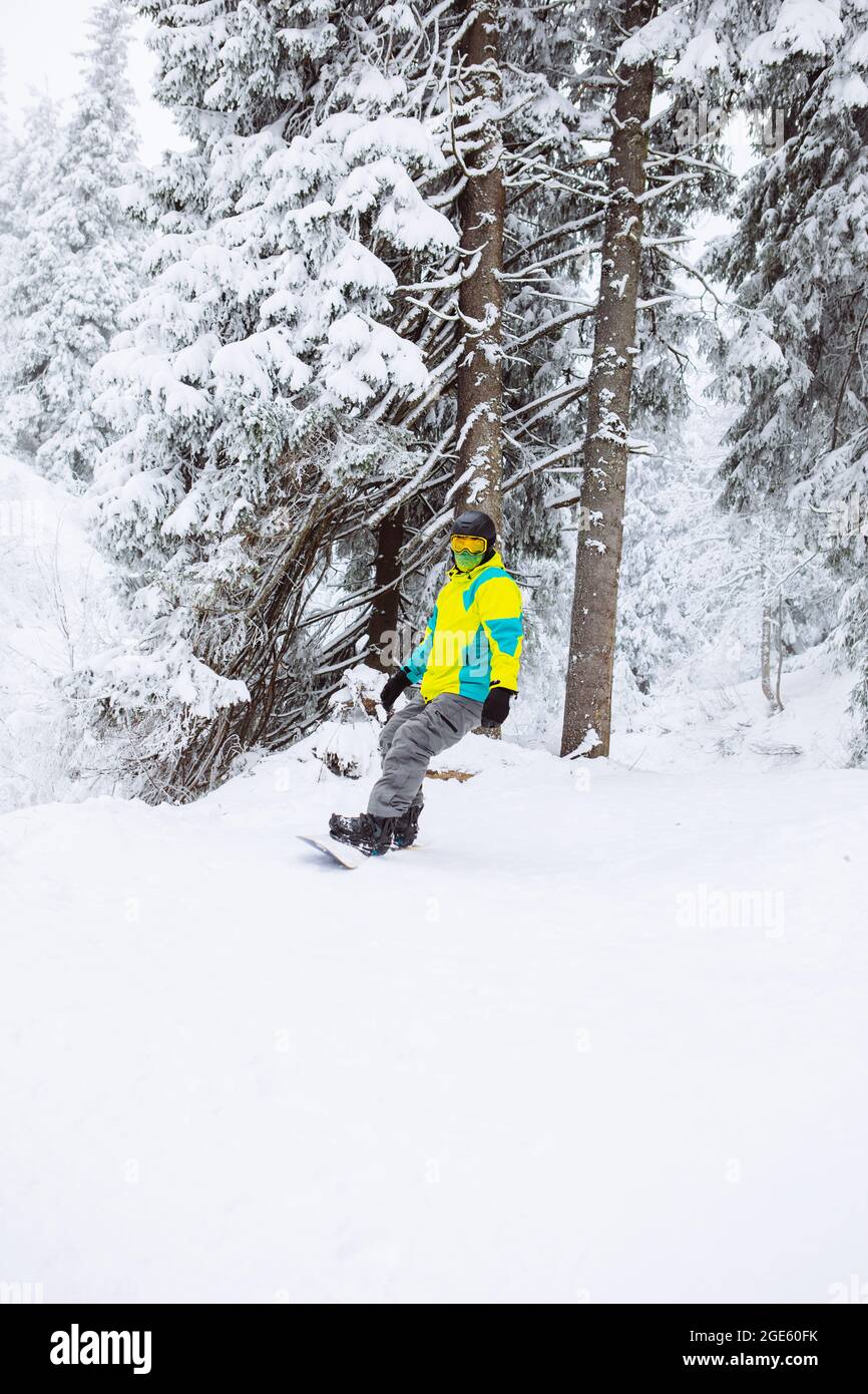 man snowboarder at winter forest copy space Stock Photo - Alamy