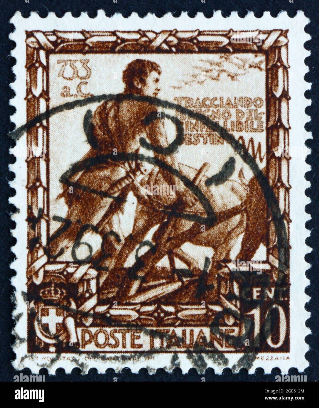ITALY - CIRCA 1938: a stamp printed in the Italy shows Romulus Plowing ...