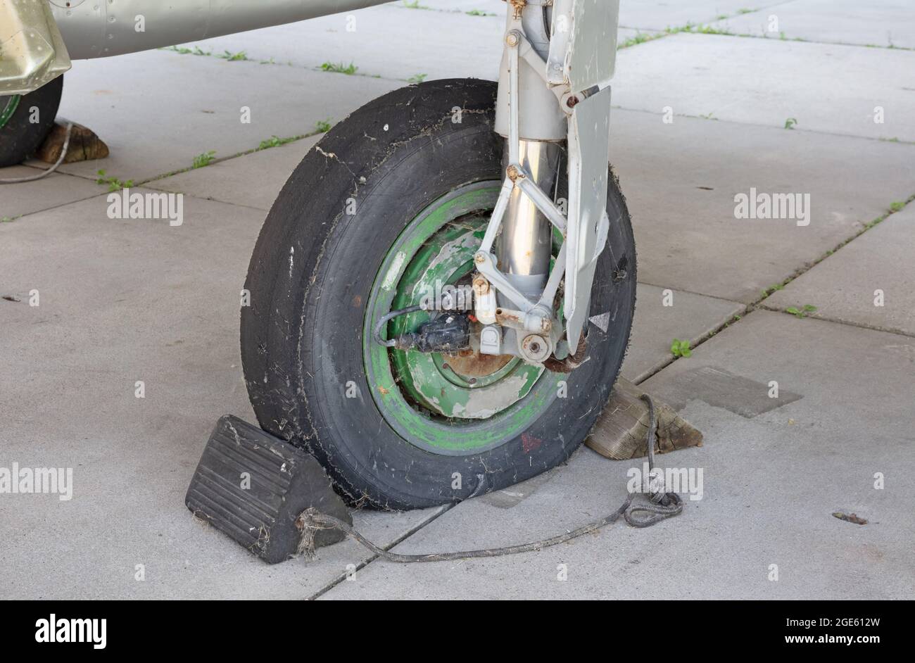 Old black flat wheel of an fighter jet, selective focus Stock Photo - Alamy