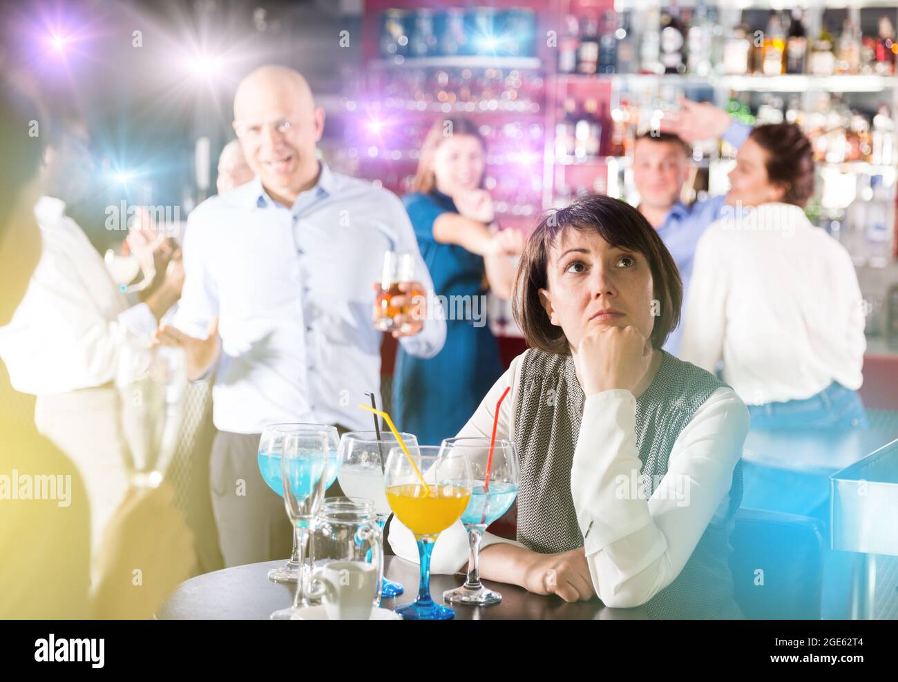 Bored woman at party Stock Photo - Alamy