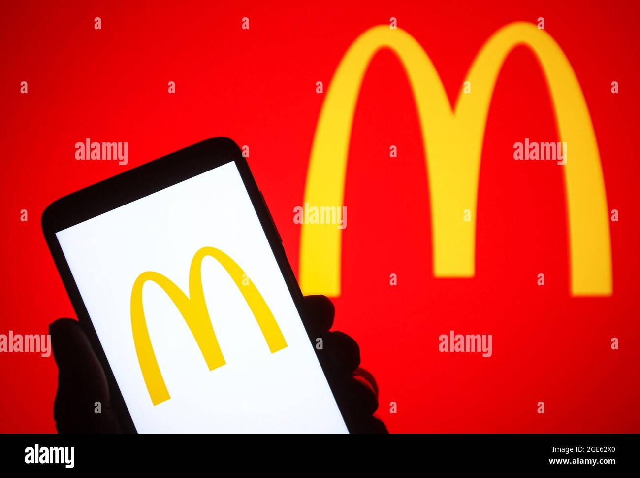 In this photo illustration a McDonald's logo is seen on a smartphone in ...