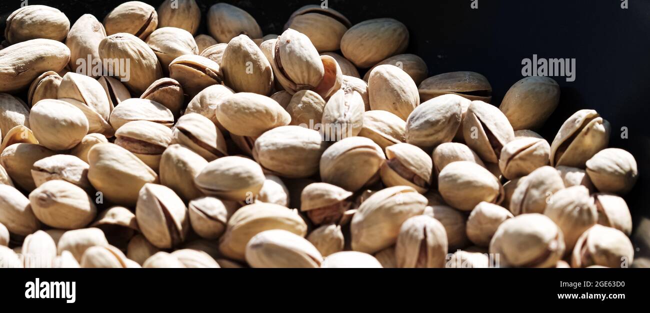 Organic pistachios in the sun, healthy food and snack background Stock ...