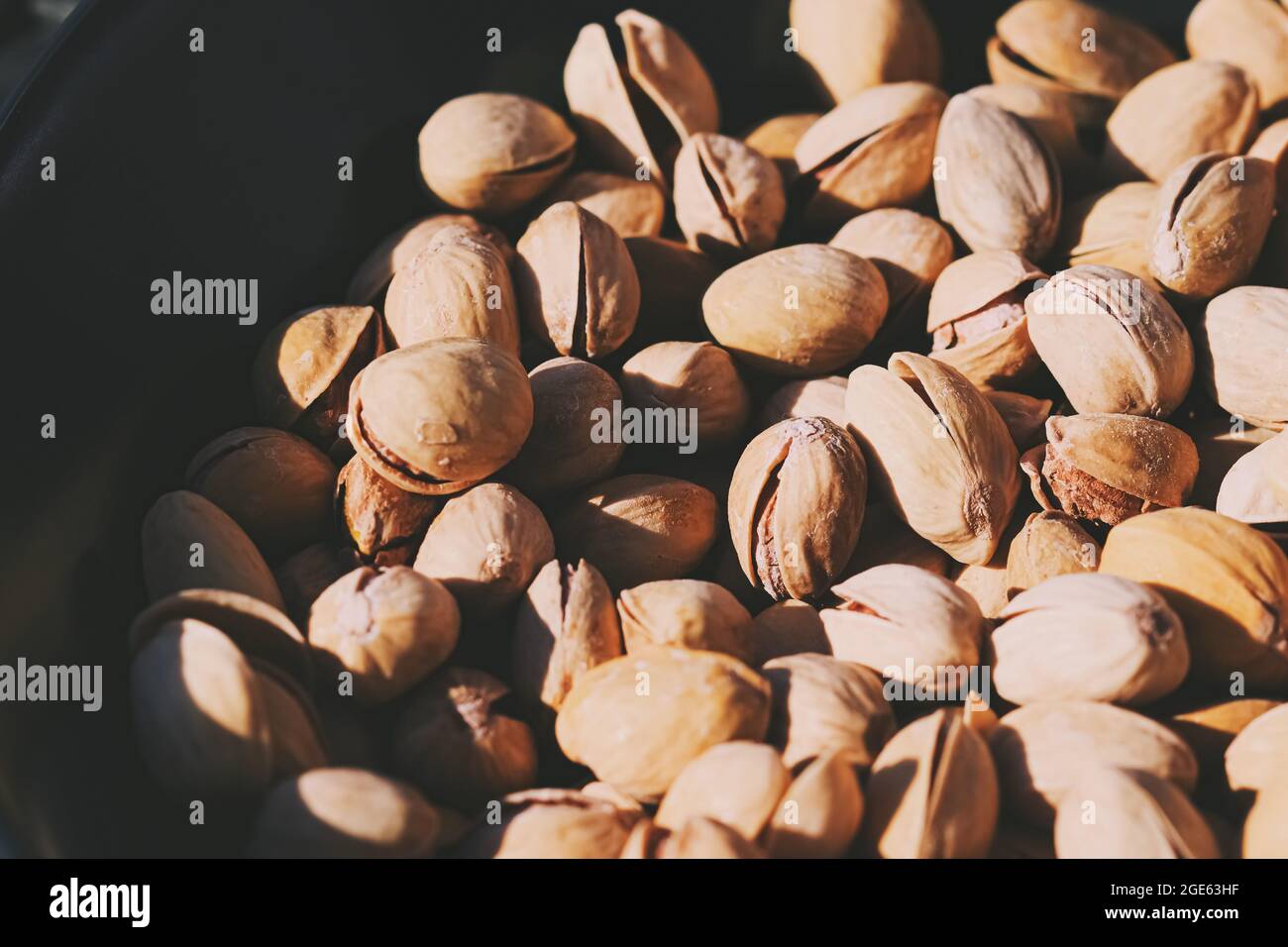 Organic pistachios in the sun, healthy food and snack background Stock ...