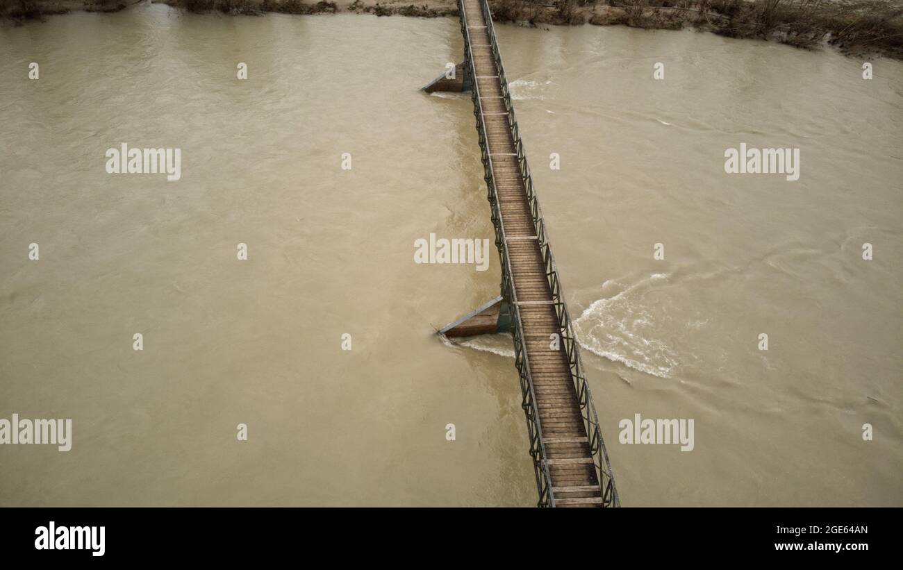 Droneflight over the flooded river with a bridge Stock Photo - Alamy