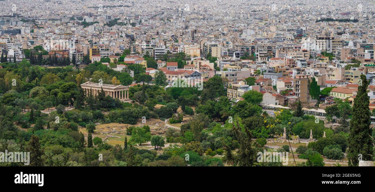 Cityscape of Athens at cloudy day. City near hills. Urban architecture ...