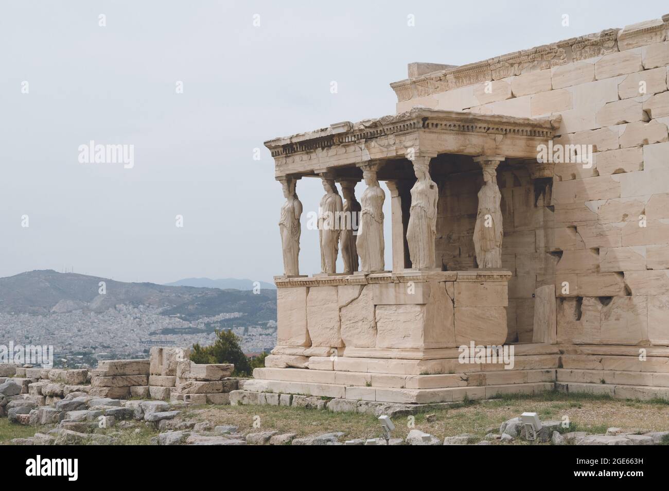 Ancient marble temple on Acropolis hill in Athens, Greece. Caryatids of ...