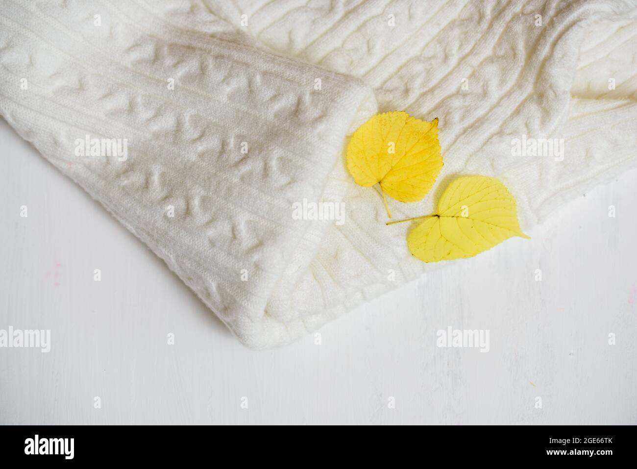 White Knitted Fabric Texture.Knitting, handmade.Yellow autumn leaf ...