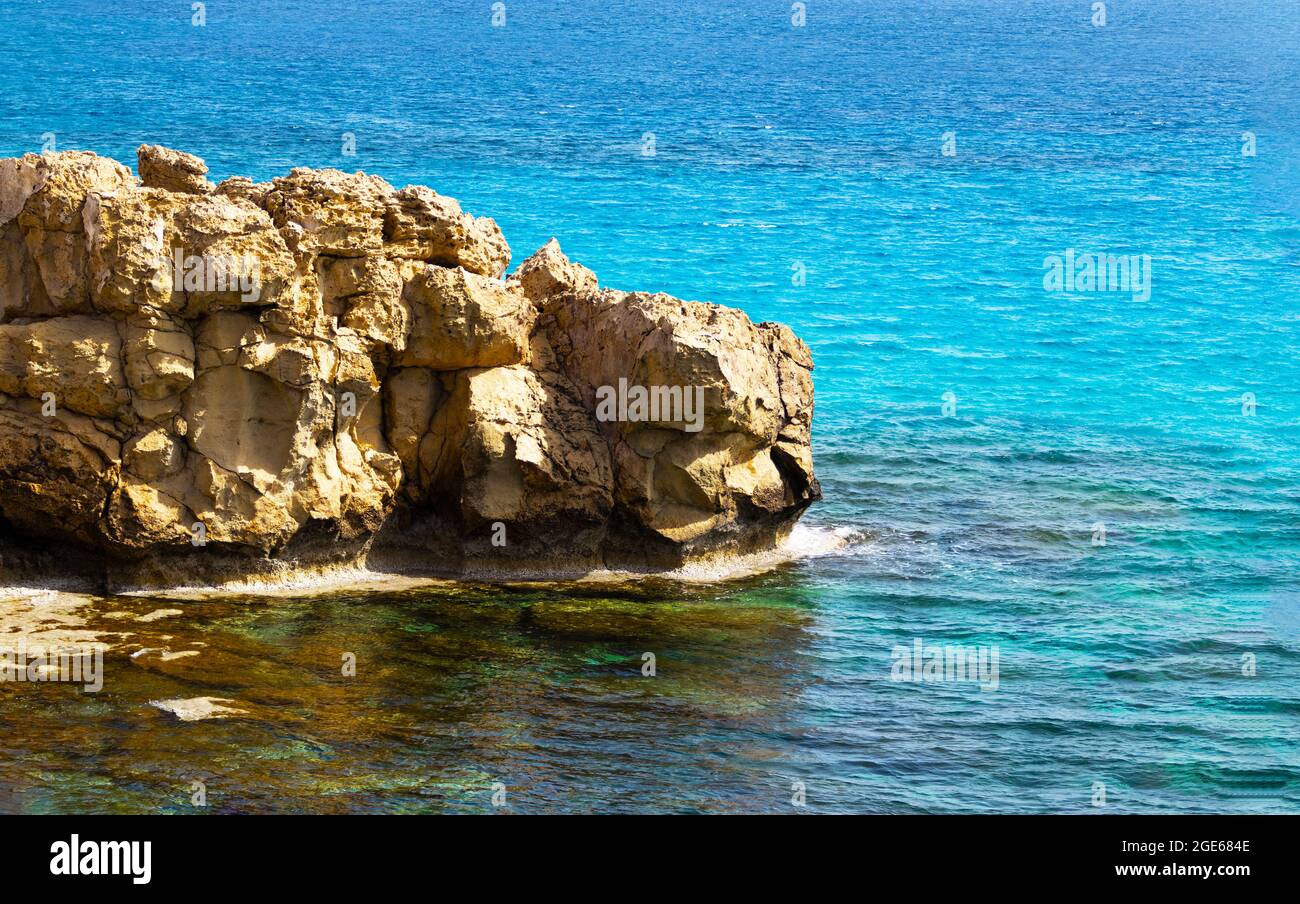 Mediterranean sea beach with lonely rock. Summer day seascape. Clear ...