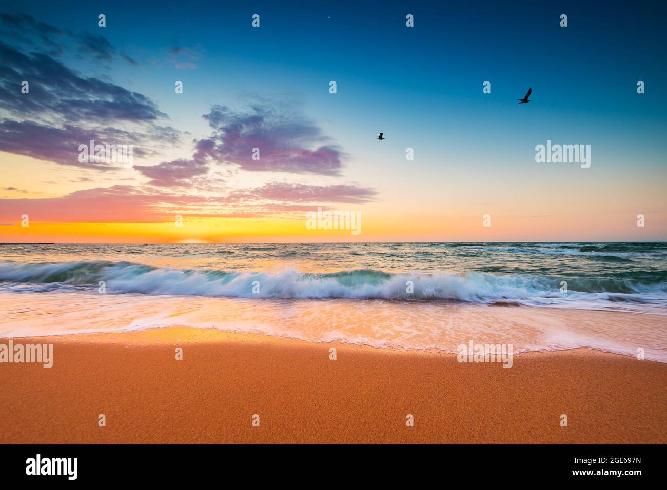 Beautiful cloudscape over the sea, sunrise shot Stock Photo - Alamy