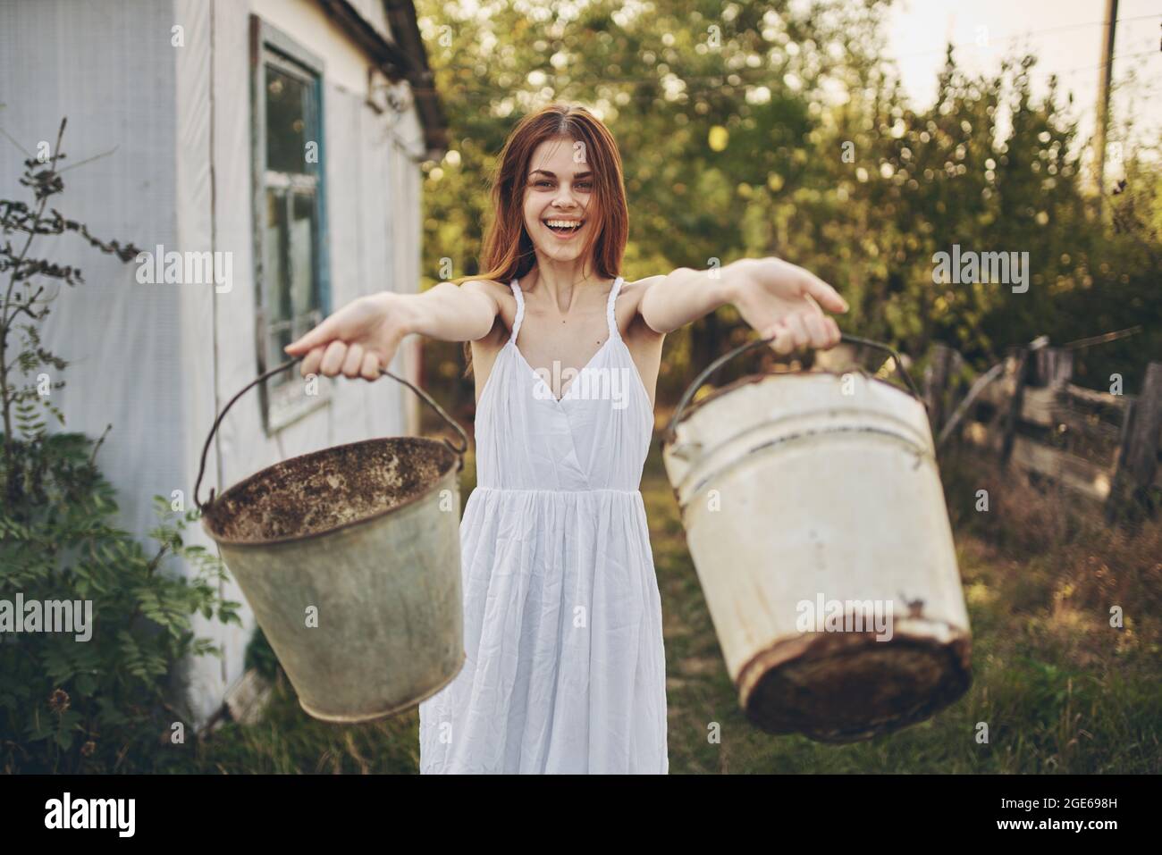 woman in white dress summer countryside Sun freedom Stock Photo - Alamy
