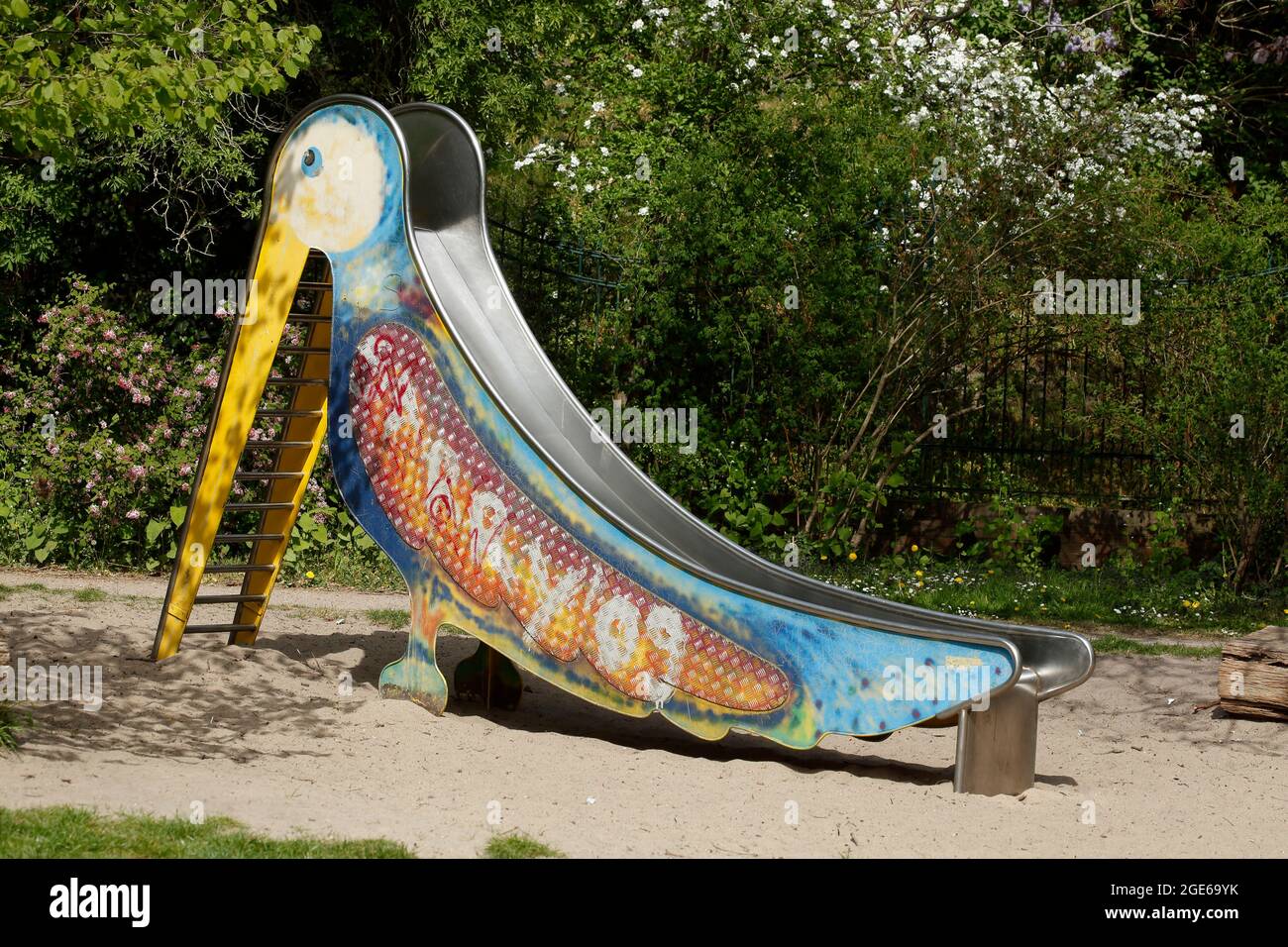 Colorful painted slide on a children playground, Germany, Europe Stock ...