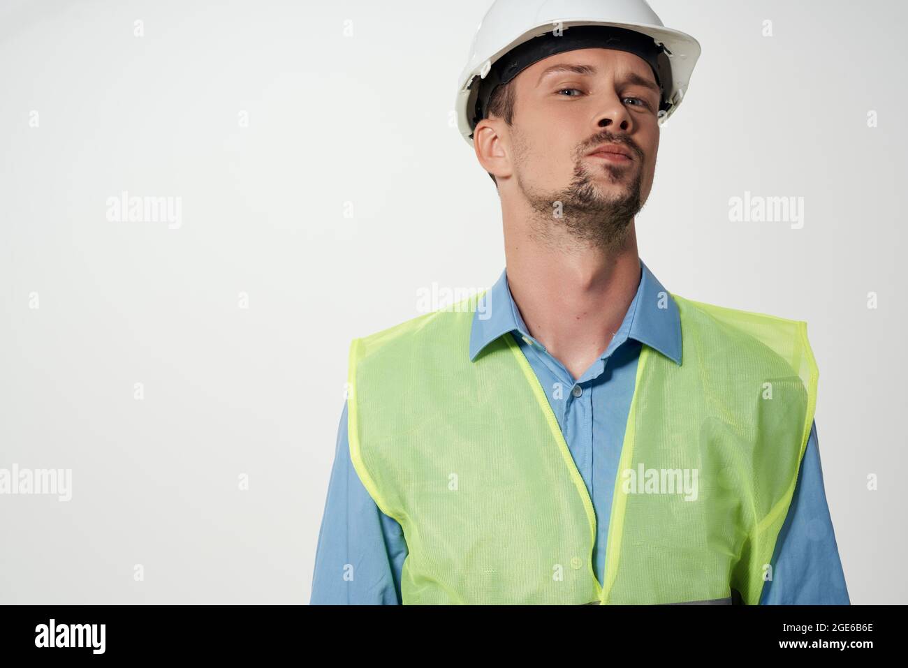 male builders Professional Job light background Stock Photo - Alamy