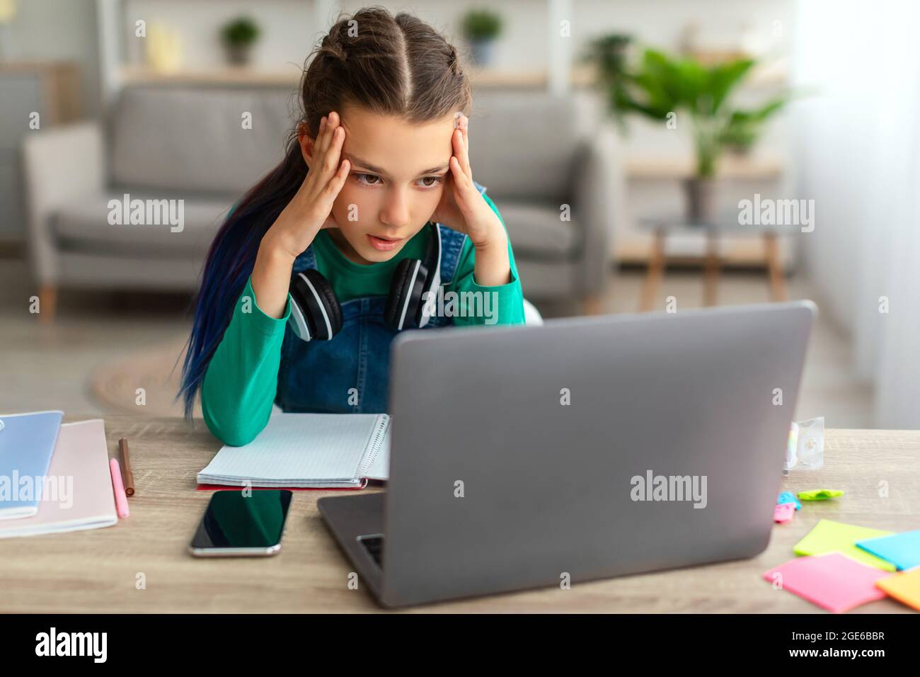 Information Overflow And Overload. Little female student sitting at ...