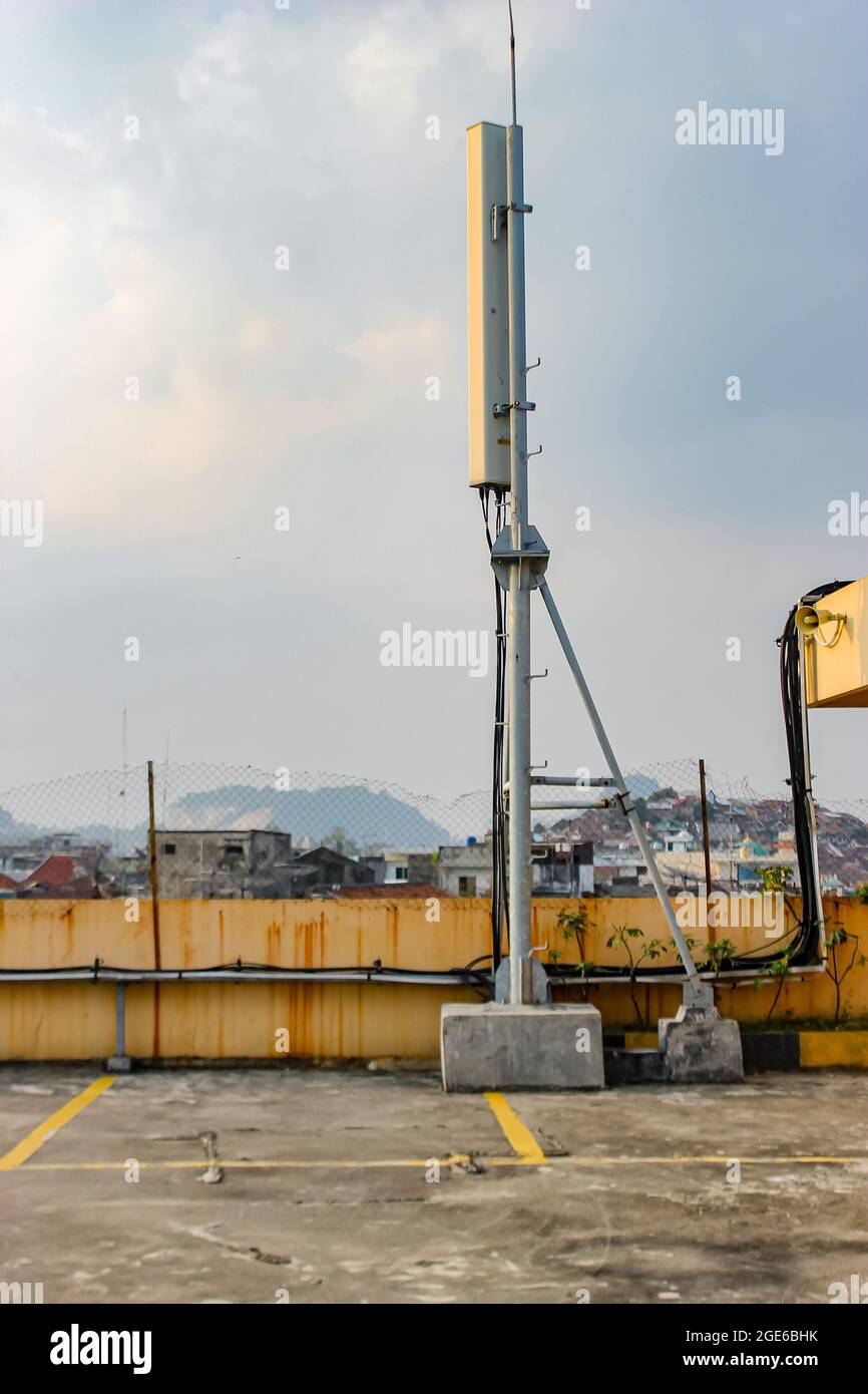 Signal Transmitter Pole on the top of the building Stock Photo - Alamy