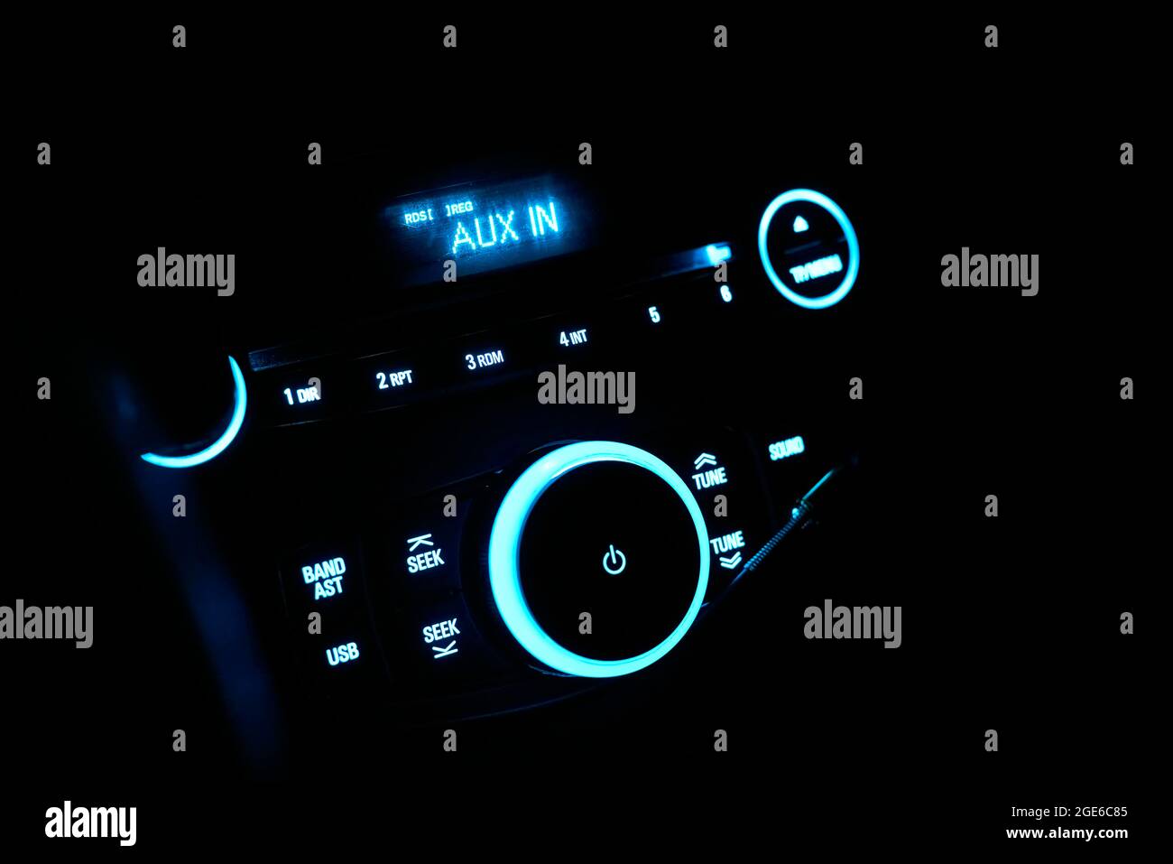 Automobile stereo in neon light at night. Dashboard with audio ...