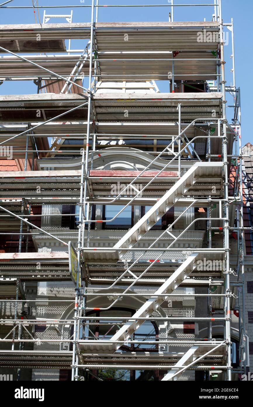 Construction site, scaffolding, house facade, roof gable, old building ...