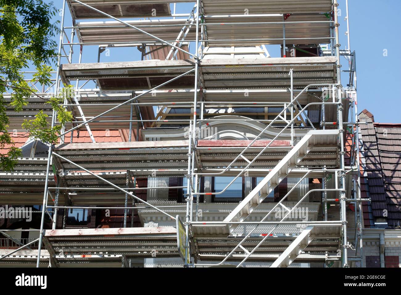 Construction site, scaffolding, house facade, roof gable, old building ...