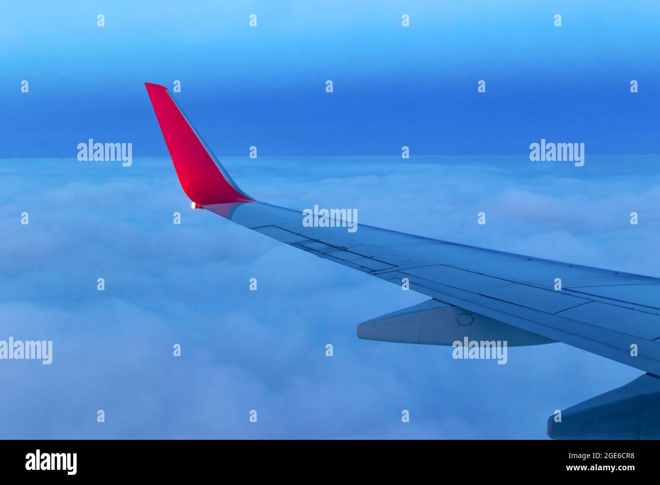 a view from a height above the clouds from the plane's window. part of ...