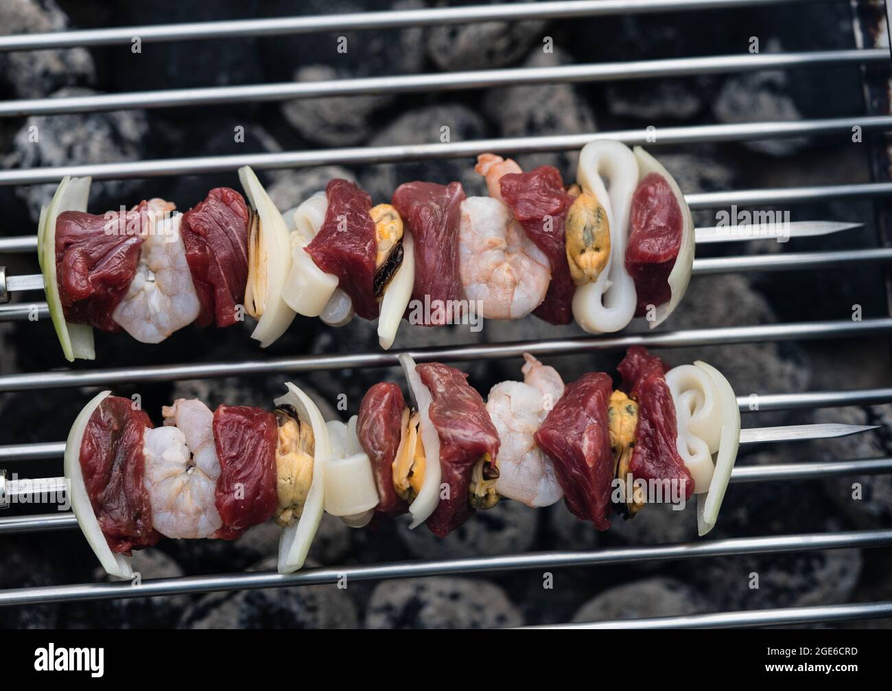 Surf and turf grilled steak and seafood on a skewer Stock Photo - Alamy