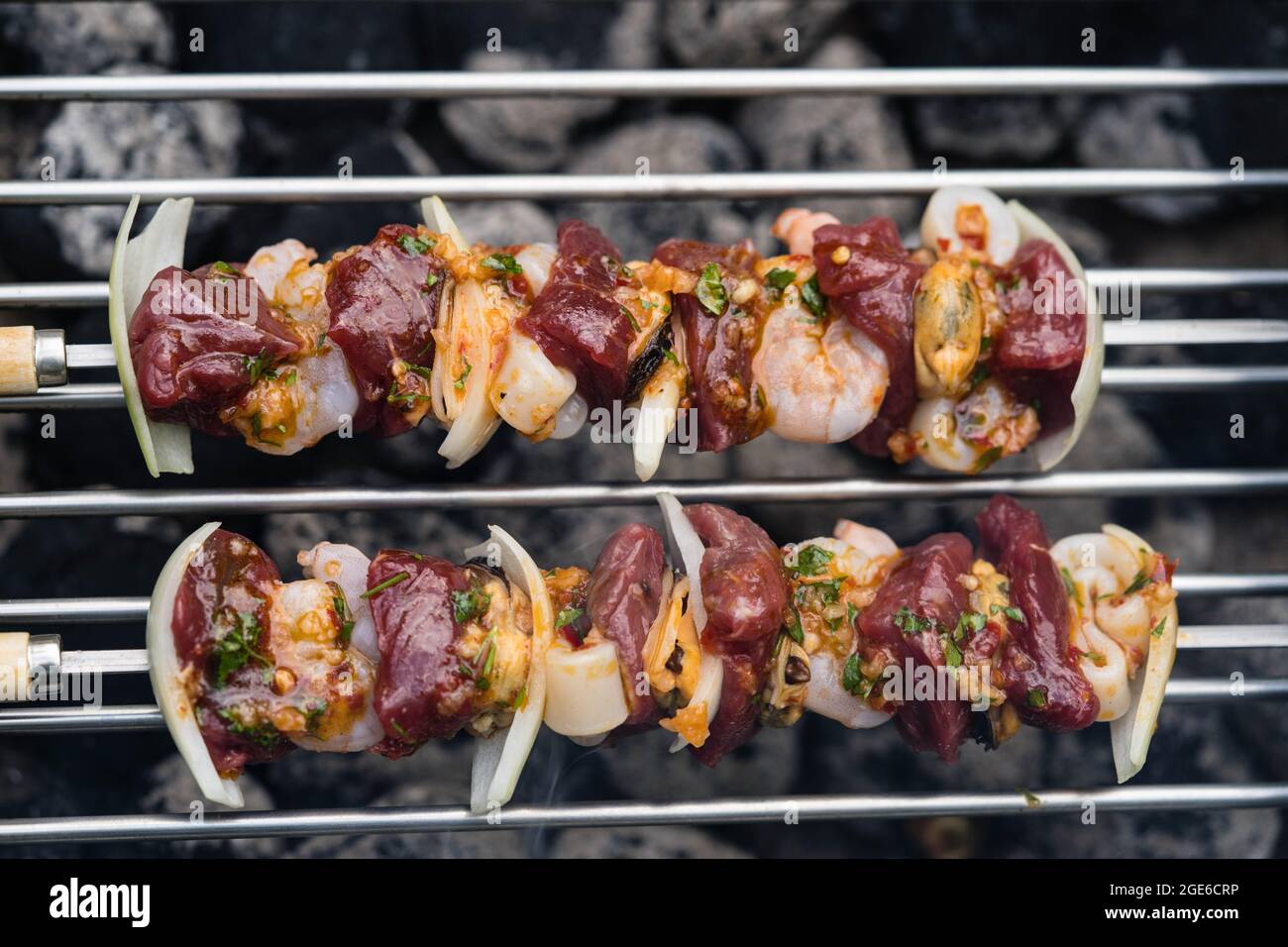 Surf and turf grilled steak and seafood on a skewer Stock Photo - Alamy