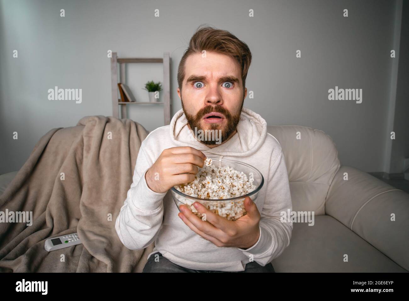 Portrait of guy watching TV series online. Online cinema and video ...