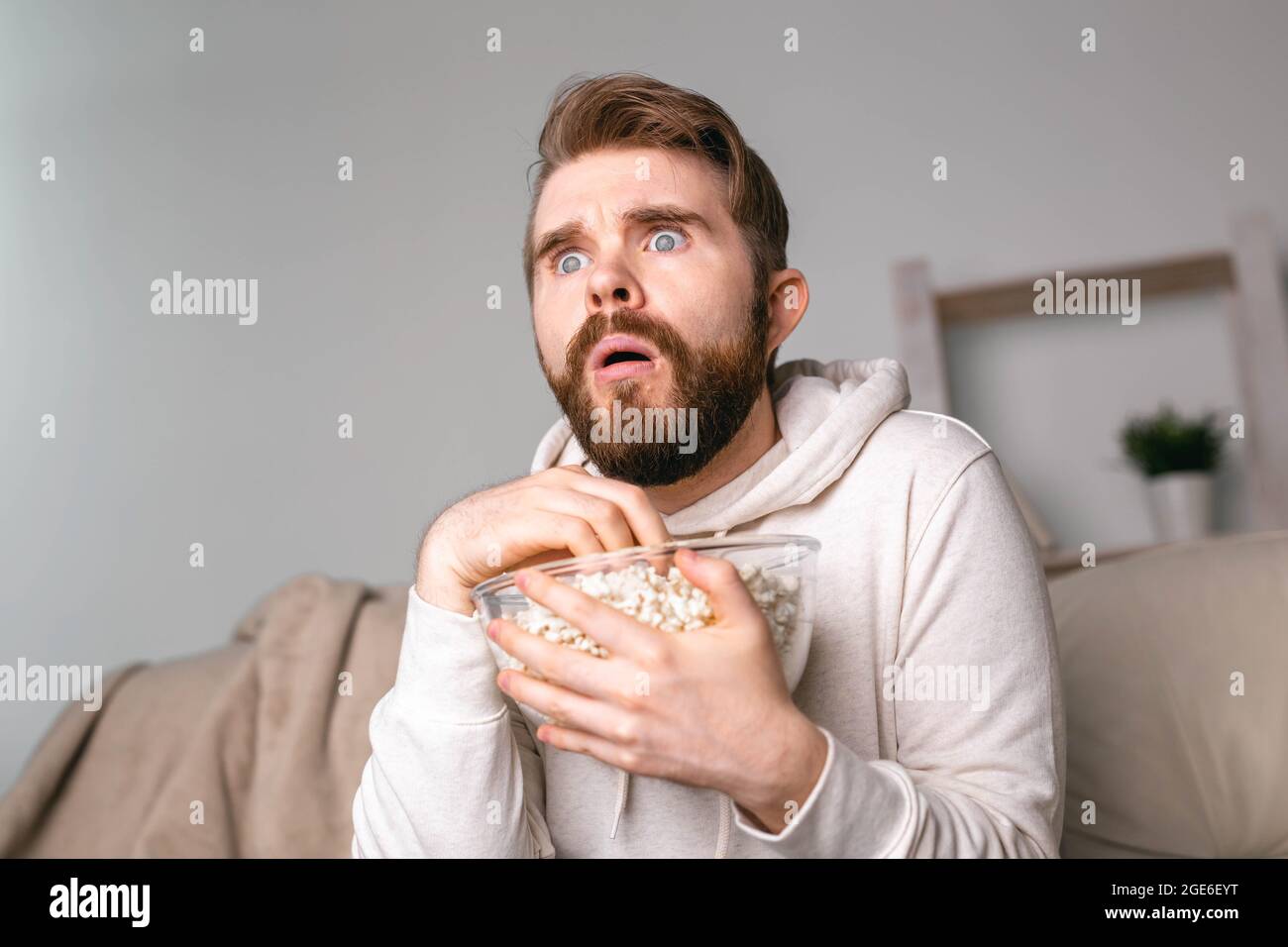 Portrait of guy watching TV series online. Online cinema and video ...