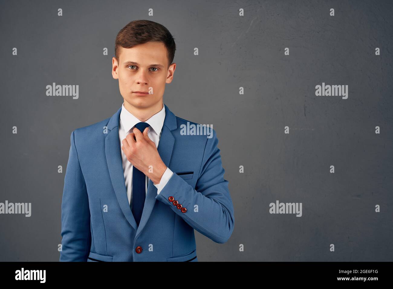 manager in a suit straightens his tie entrepreneur office professional ...