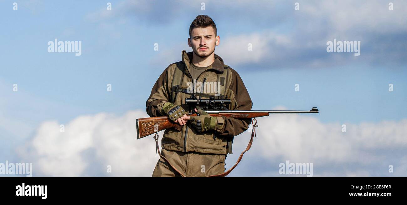 Hunter with hunting gun and hunting form to hunt sky background. Hunter ...