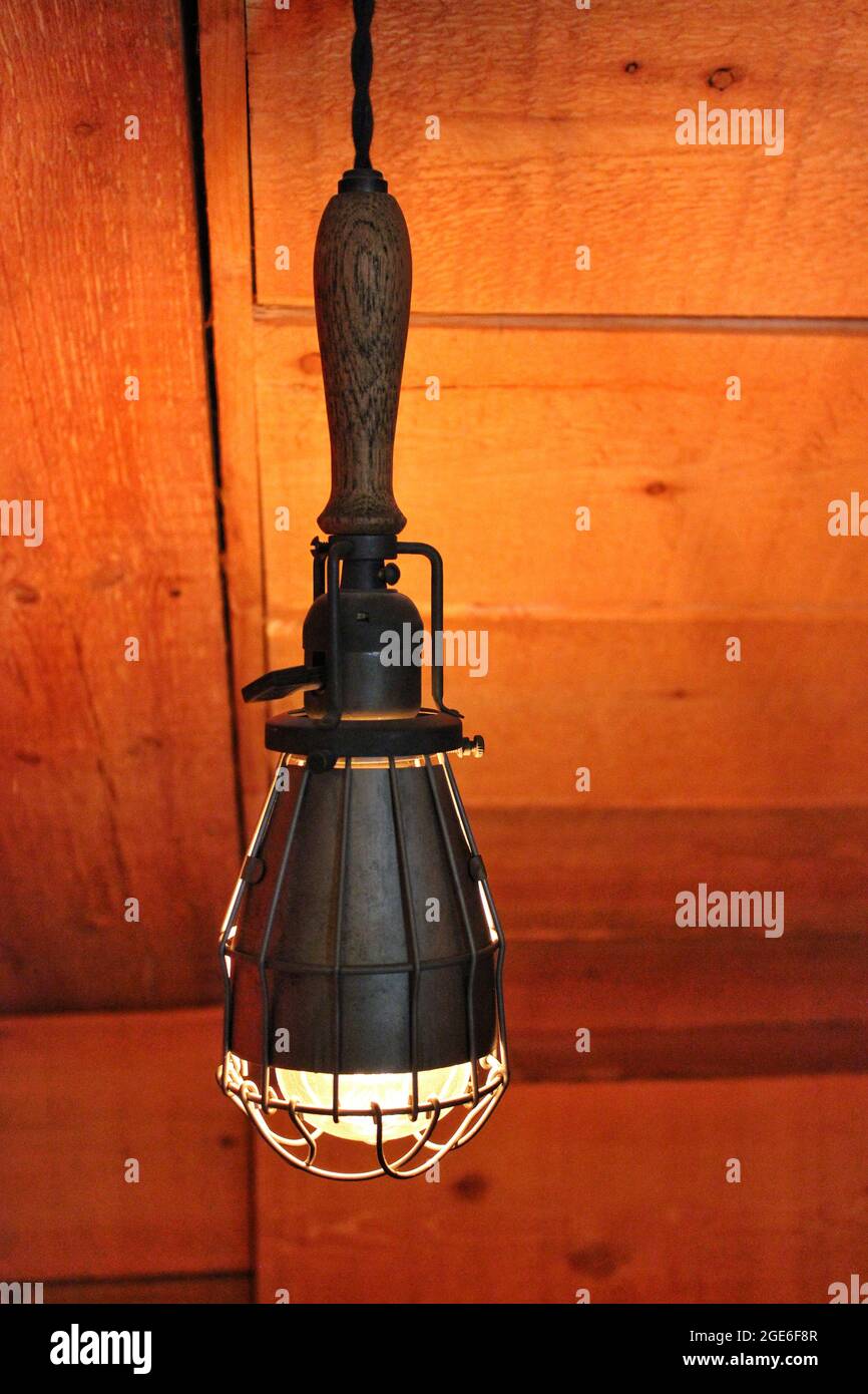 Old tool shed with vintage tools and a dim light Stock Photo - Alamy