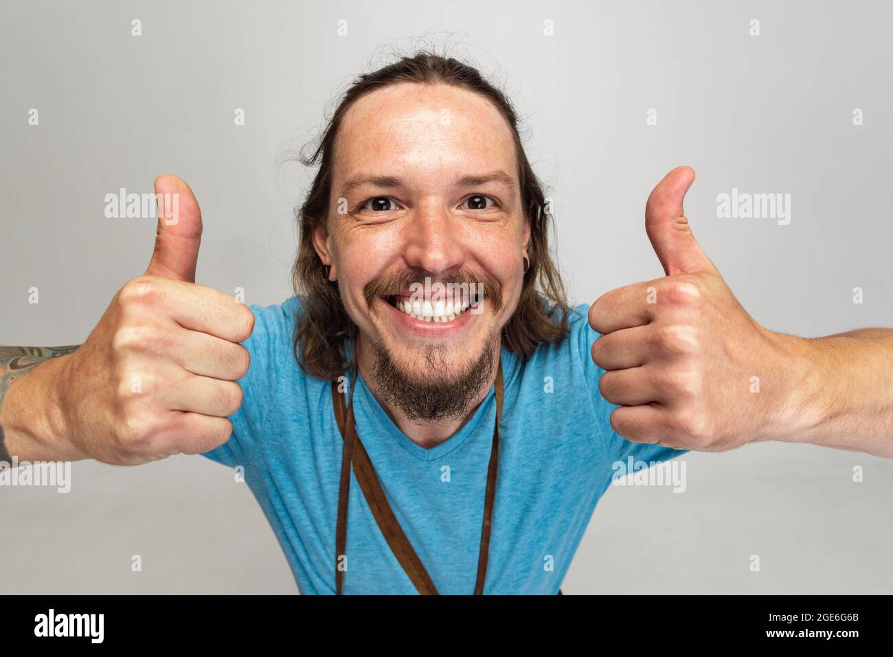 High angle view of young man, photographer, cameraman with retro camera ...
