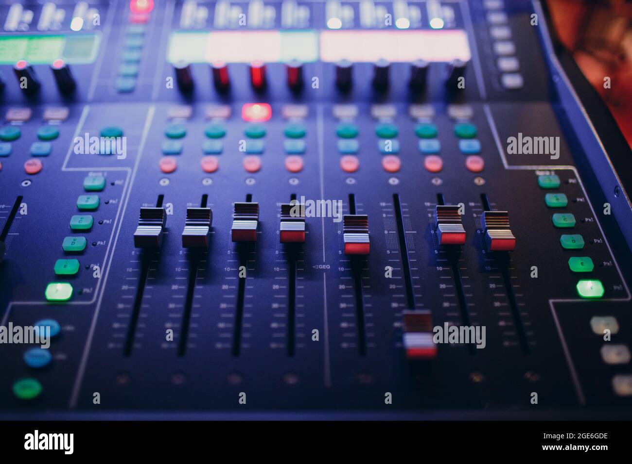 Mixing console, hand equalizing audio sound channels in night club ...