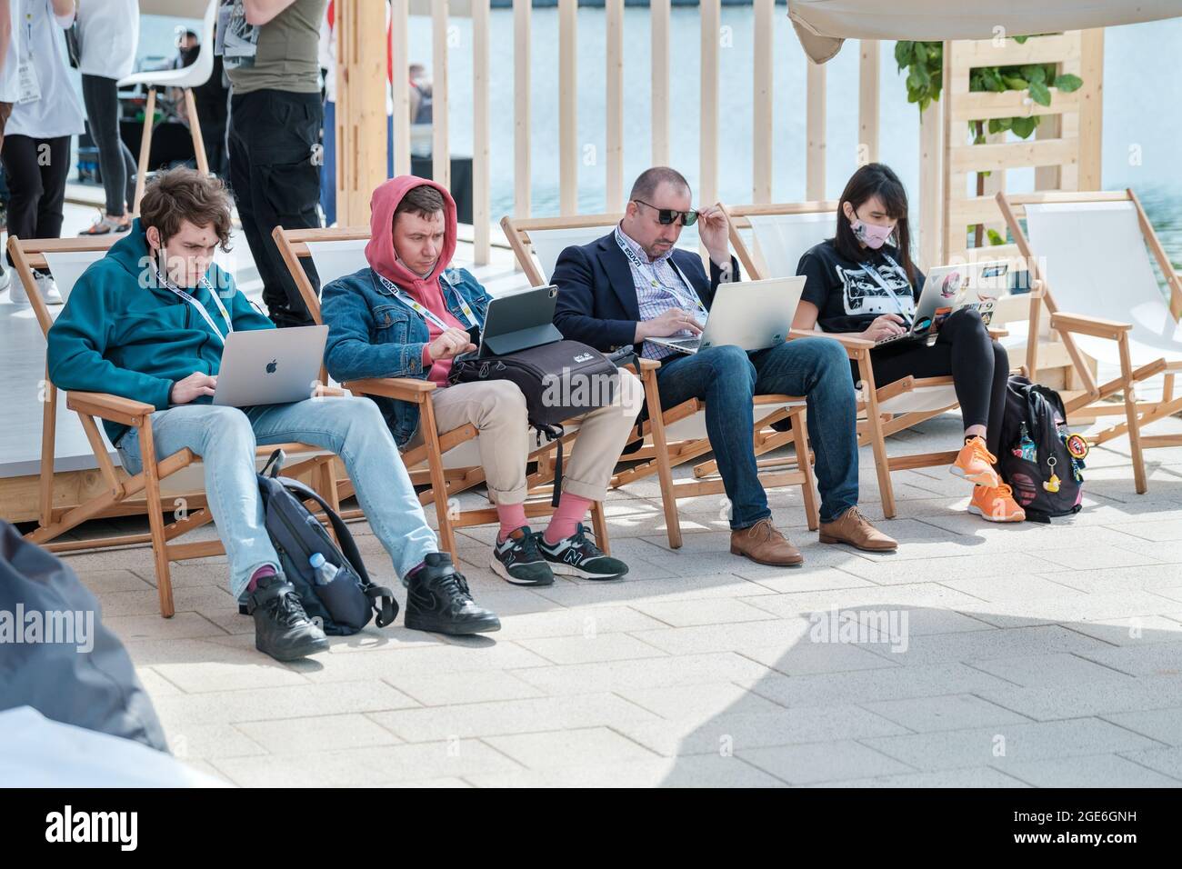 People using devices during convention Stock Photo - Alamy