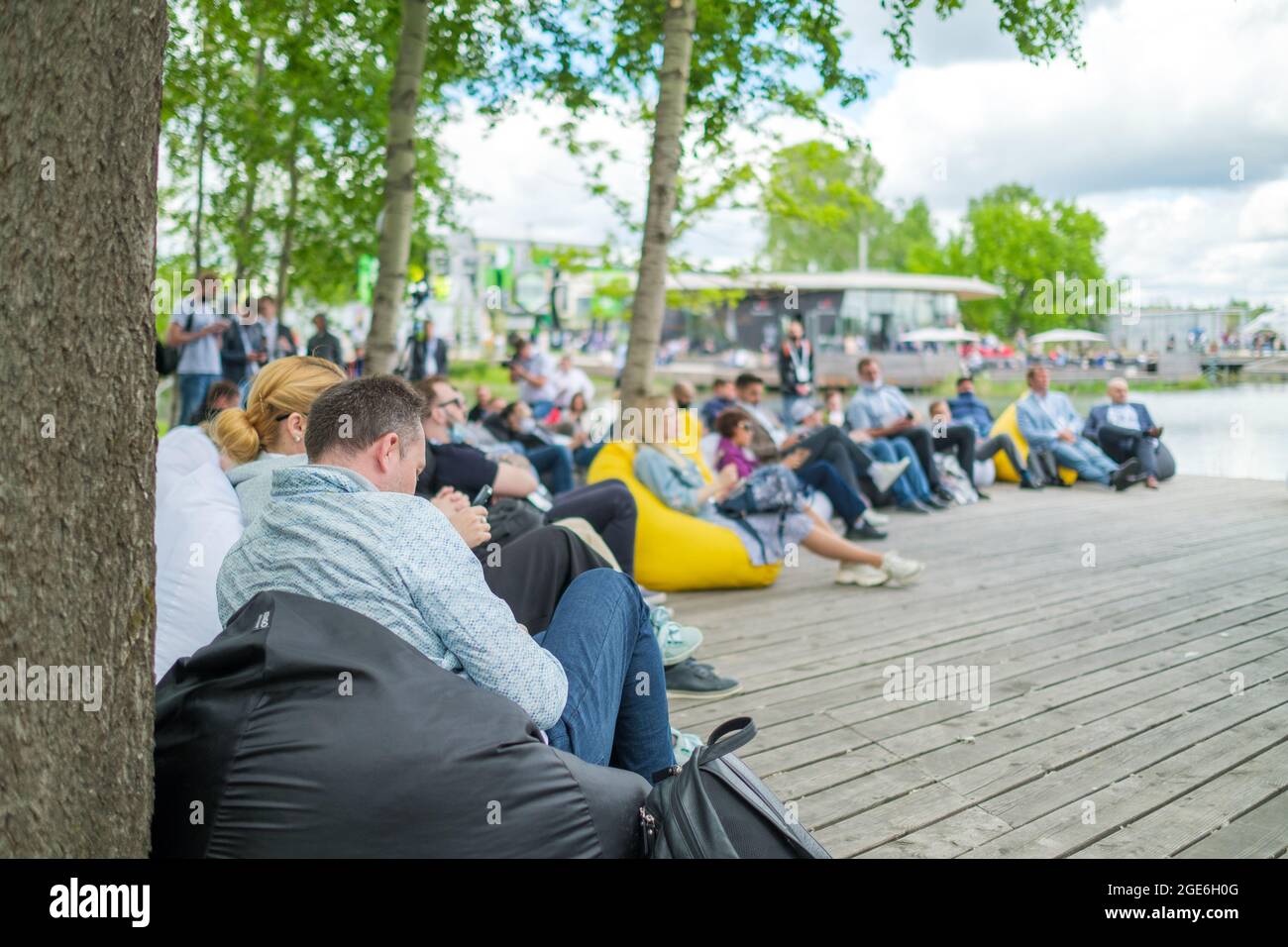 Man taking part in outdoor seminar Stock Photo - Alamy