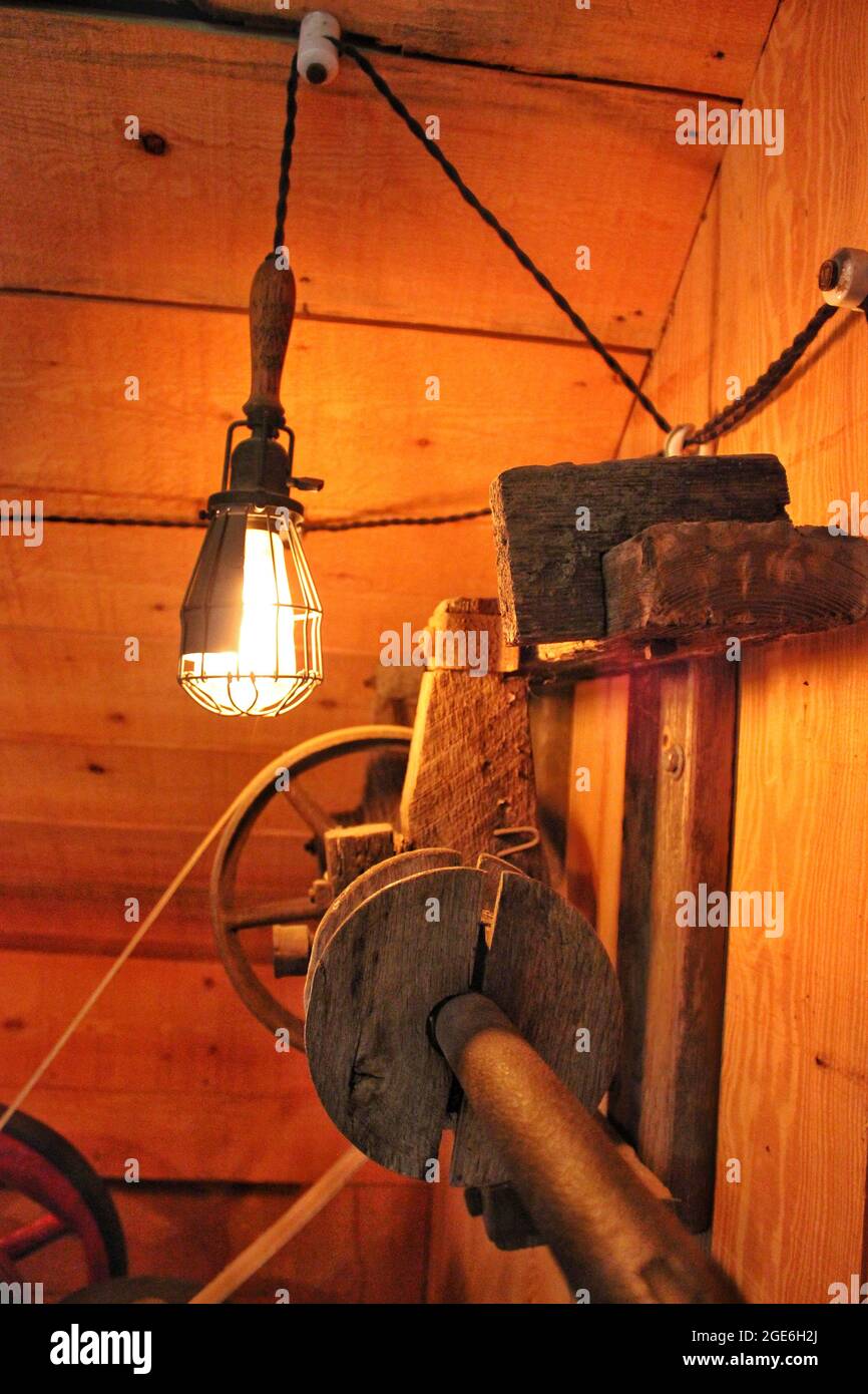 Old tool shed with vintage tools and a dim light Stock Photo - Alamy